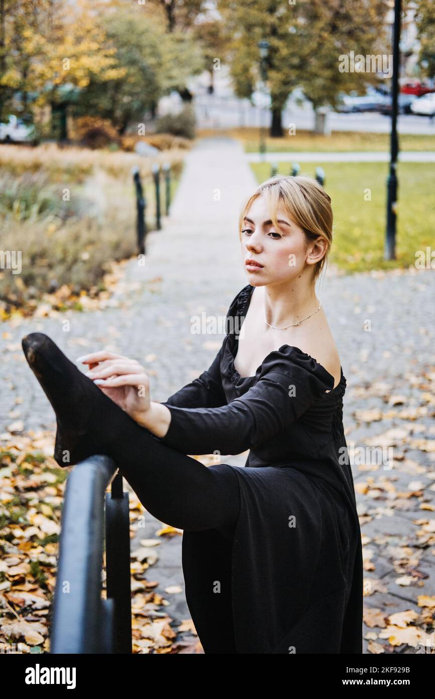Ballerina Dancing in autumn city street, Modern Ballet Dancer in black ...