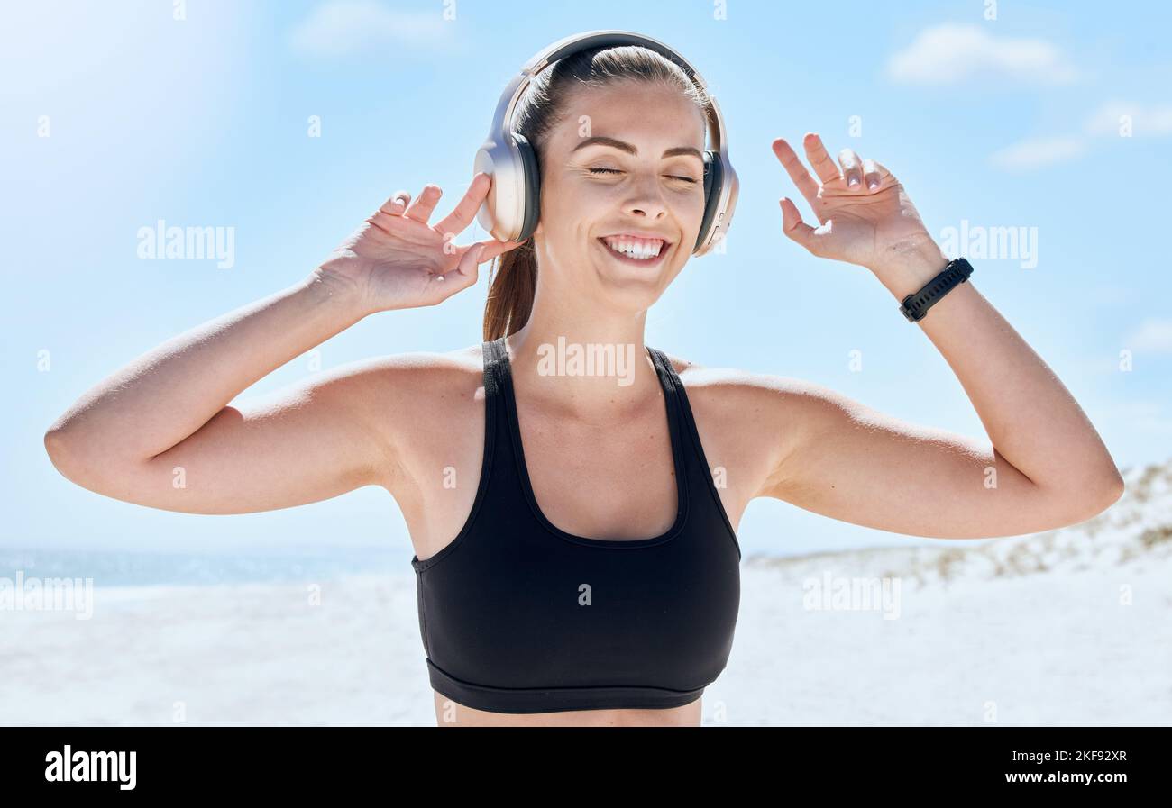 Music, headphones and woman listening during fitness outdoor, podcast ...