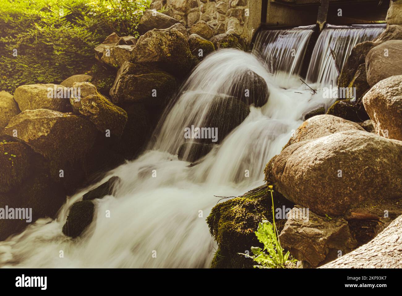 Waterfall cascade in Olivia public park Gdansk Poland. River waterfall ...