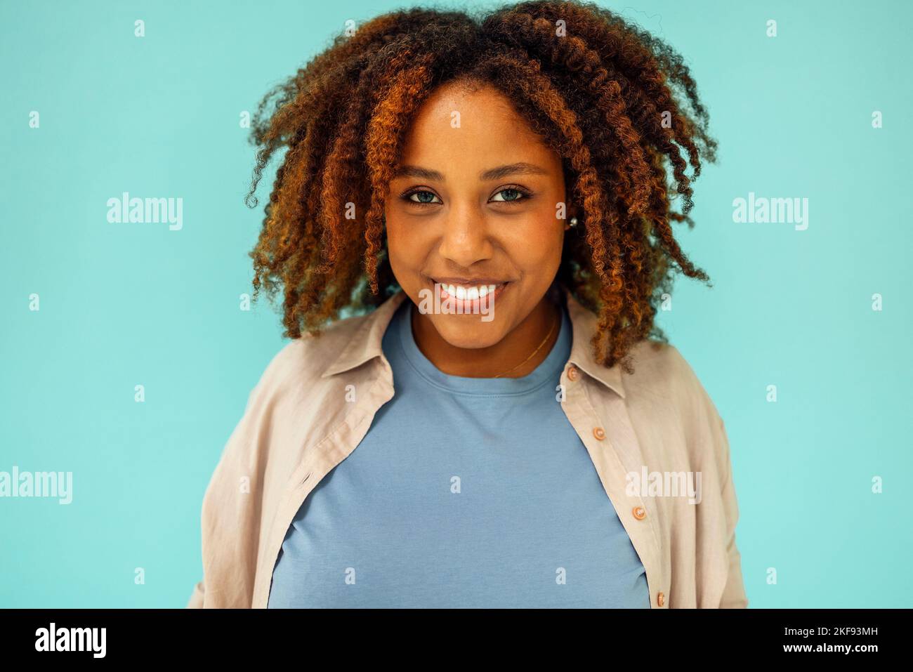 Cheerful good looking carefree young african american woman showing ...