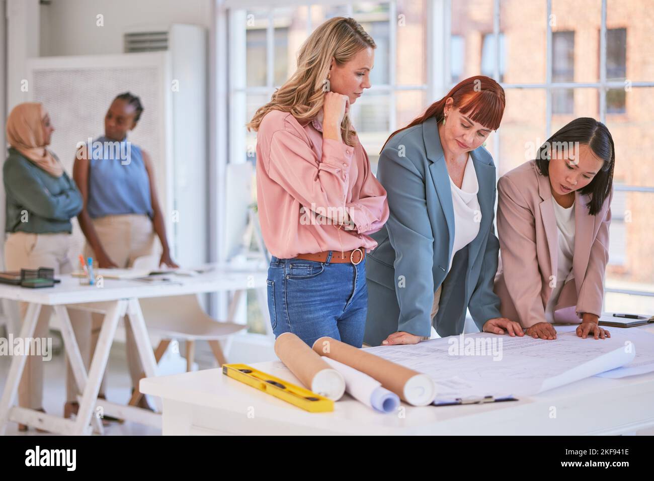 Architecture, team and blueprint with business people in meeting for planning, project ...