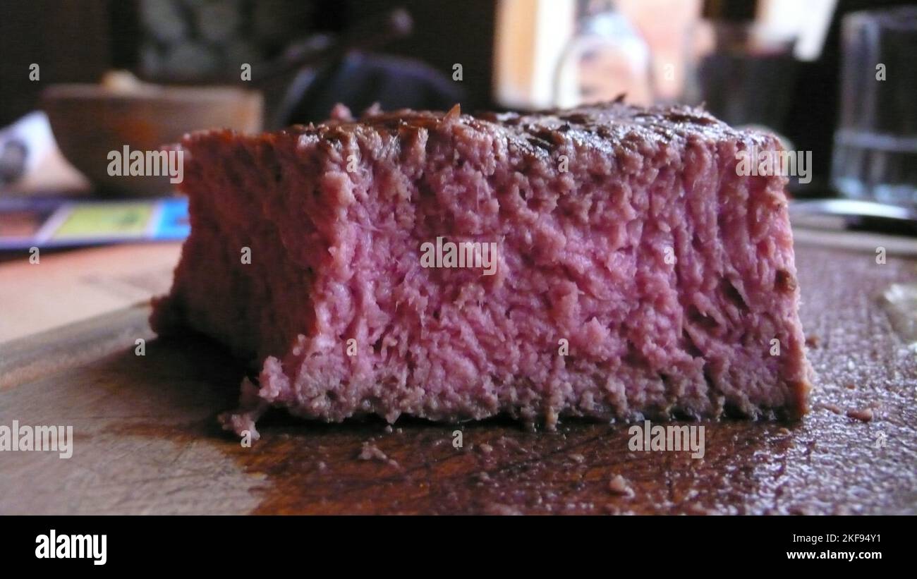 Peace of Steak medium cut pink colour detail Stock Photo - Alamy