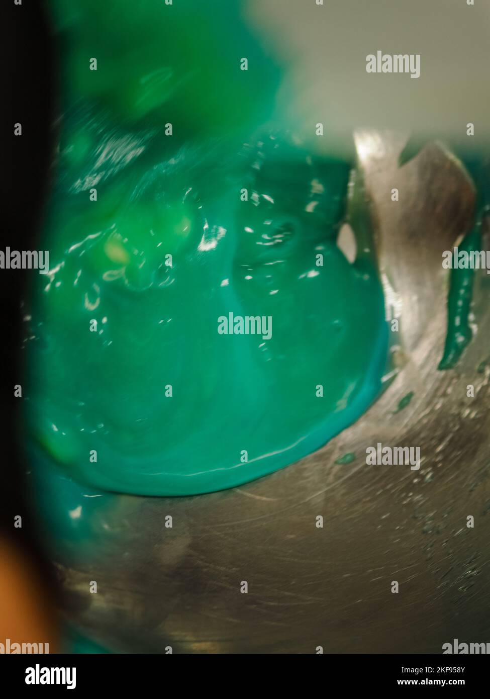 melting piping bag light blue turquoise green filling to drip a frosted ...