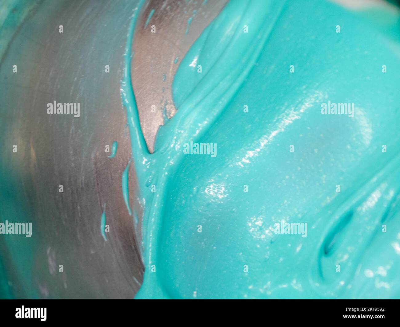 melting piping bag light blue turquoise green filling to drip a frosted ...