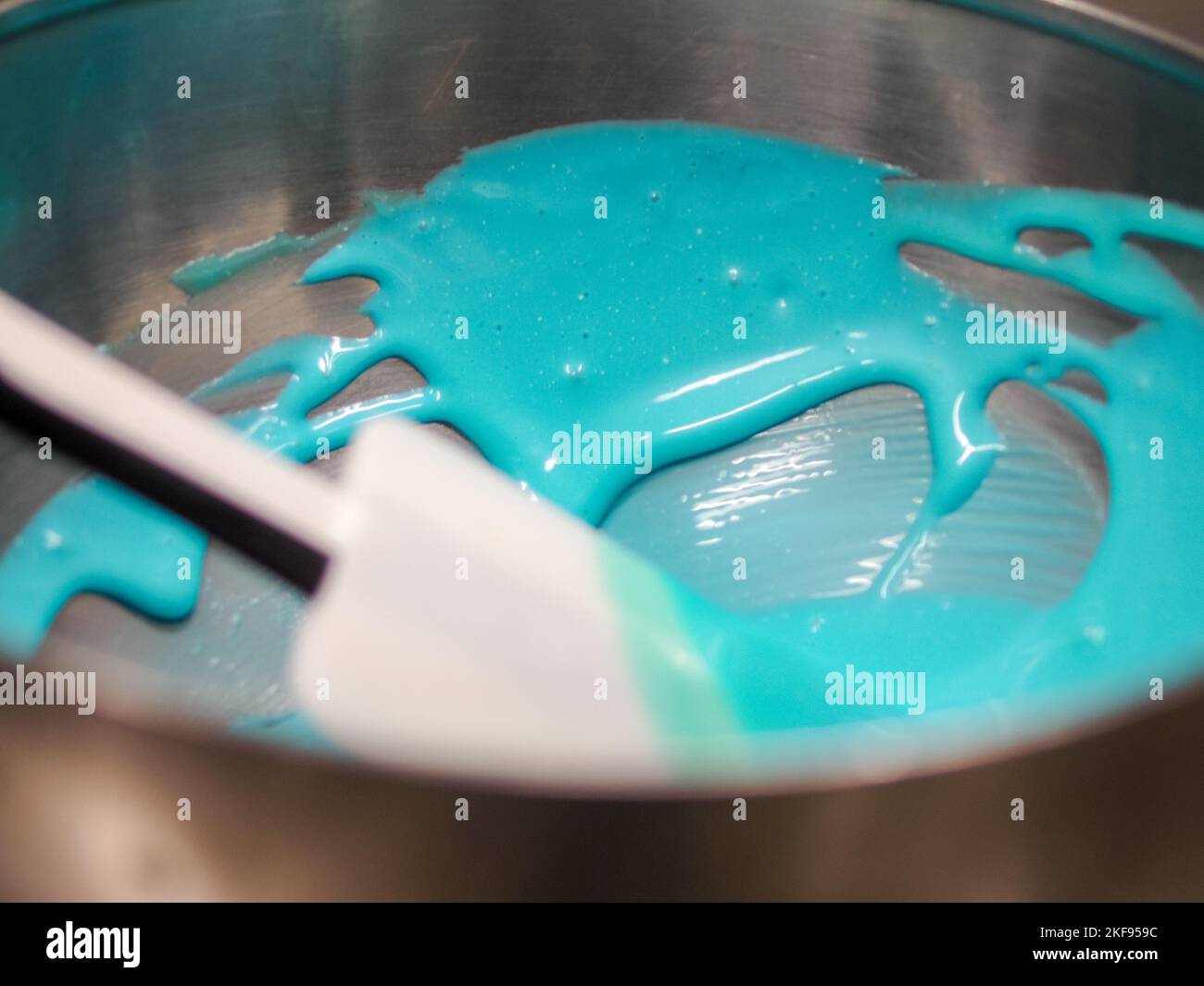 melting piping bag light blue turquoise green filling to drip a frosted ...