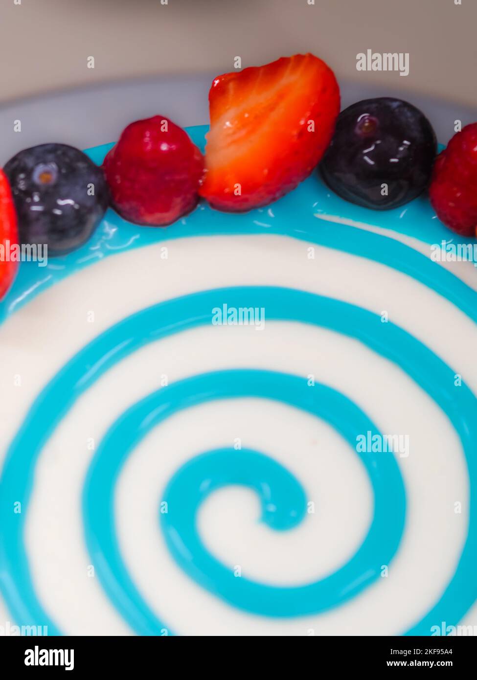 pastry chef cake designer decorating turquoise blue white frosted ...