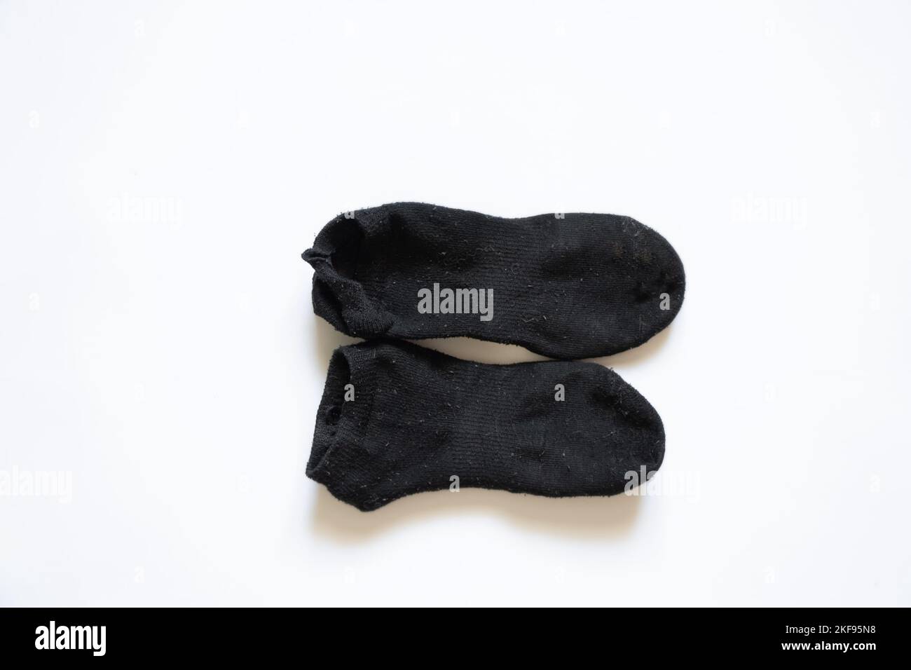 dirty black female socks on a white background, worn socks Stock Photo ...