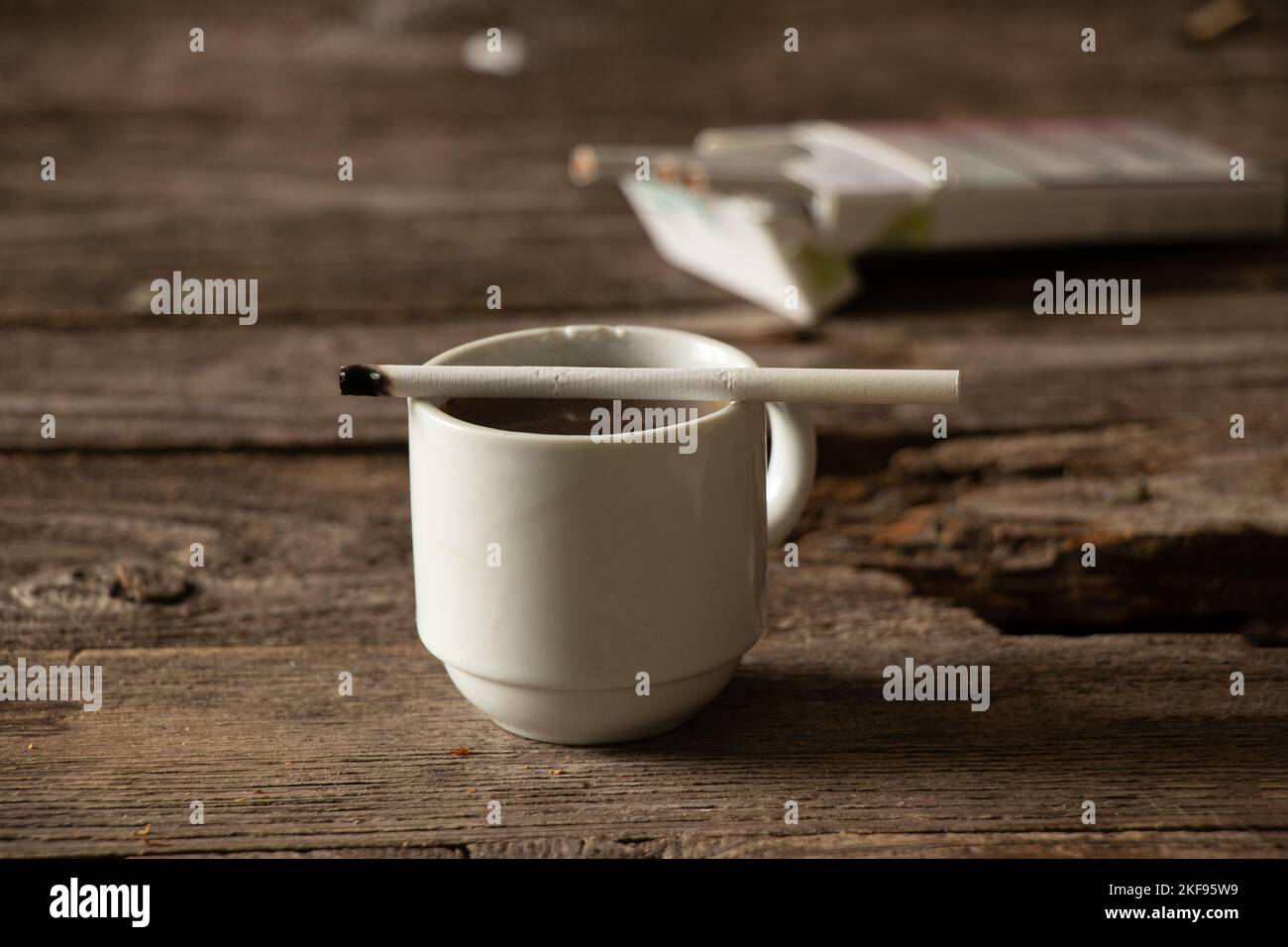 Businessman smoke cigarette drink coffee hi-res stock photography and ...