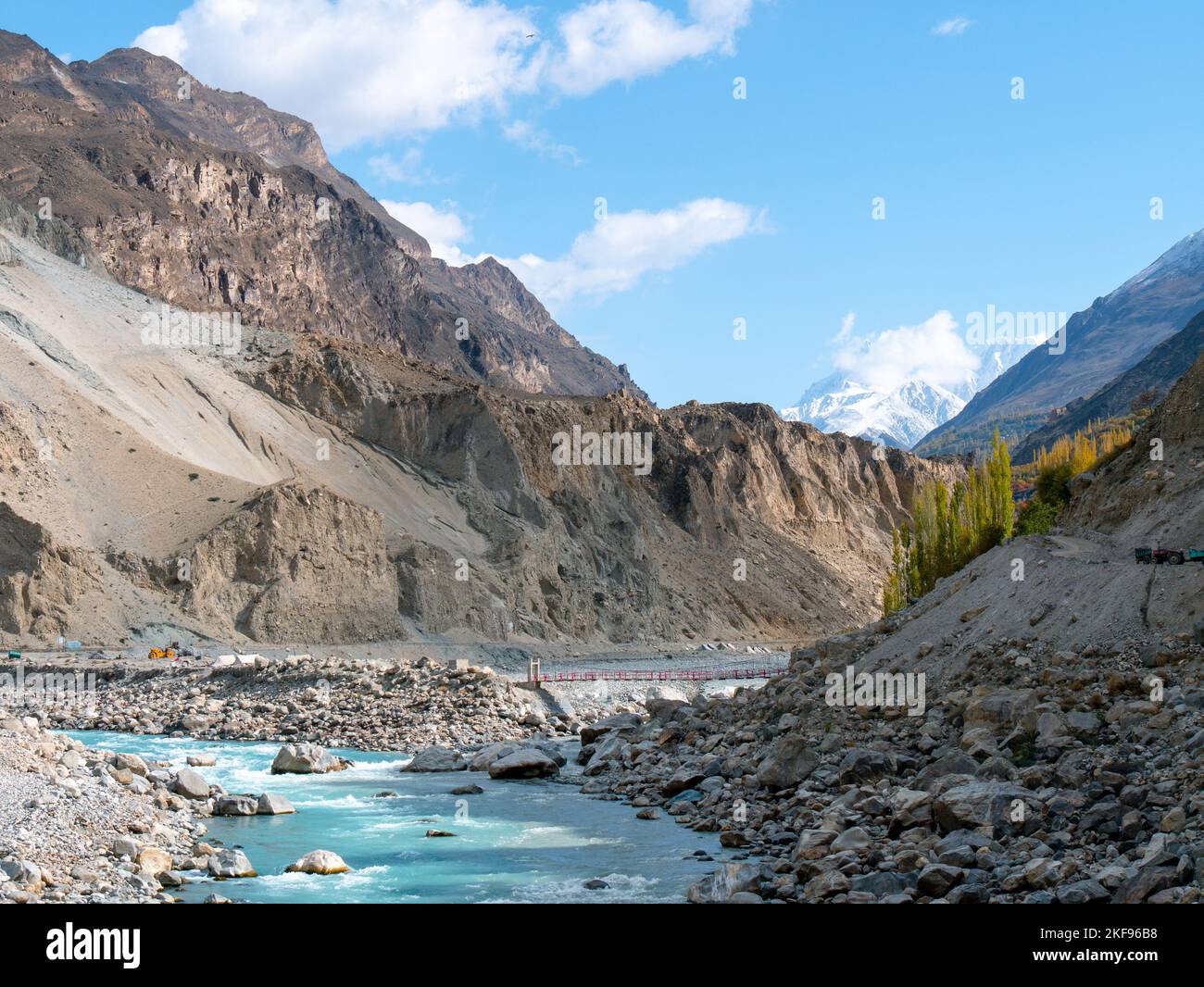 Mountainous Landscape and a bright blue river in Karimabad in the ...