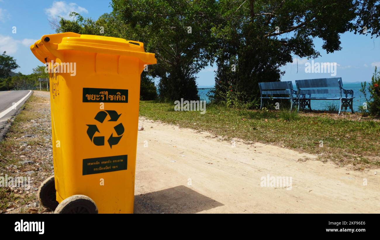 Plastic bin yellow for Garbage Waste at asphalt road in asian tropical ...