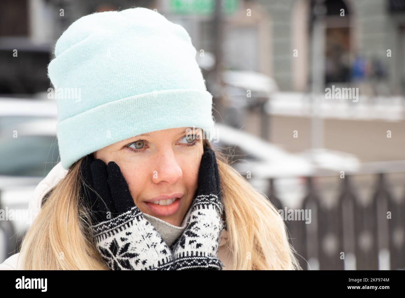 girl in winter in winter clothes in the city for a walk,portrait of a girl on the street in ...