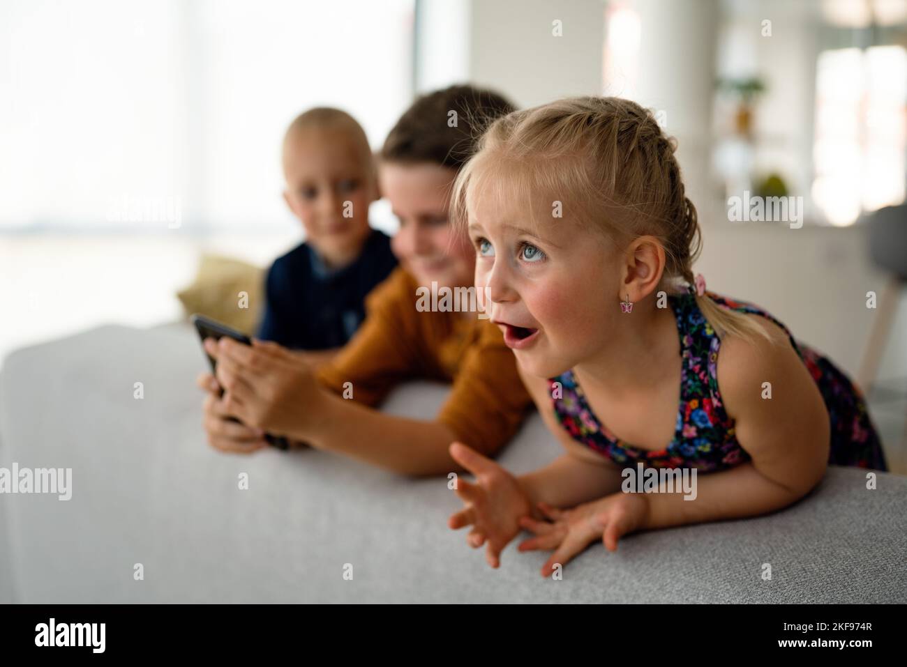 Portrait of happy children using digital devices and having fun ...