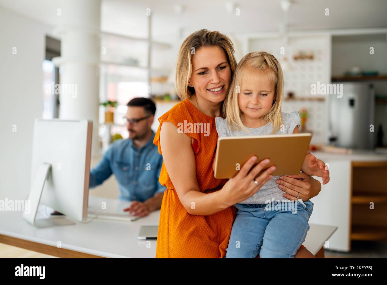 Device technology family online education concept. Happy family with ...