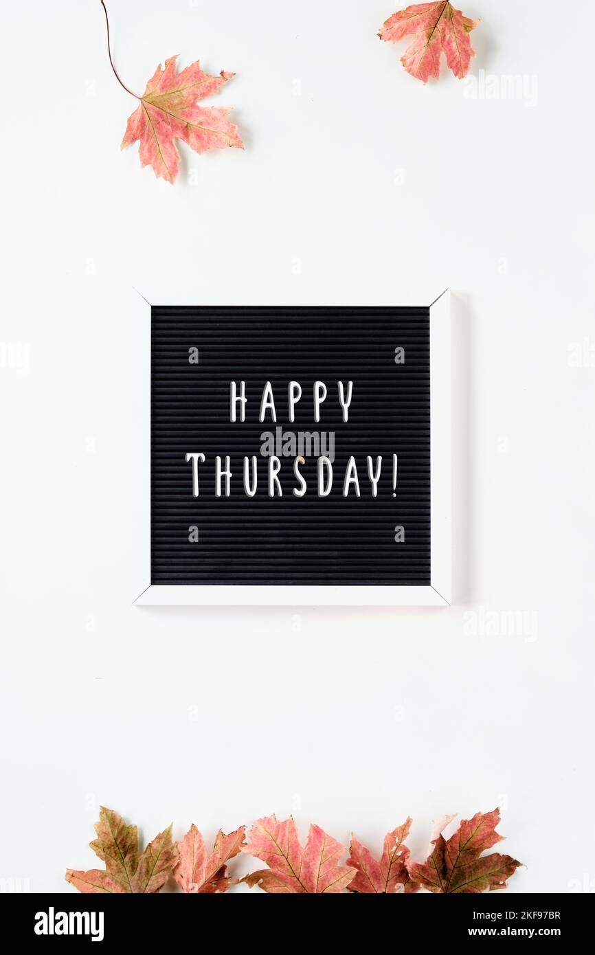 Happy Thursday greeting text on text board. Autumn leaves, simple ...