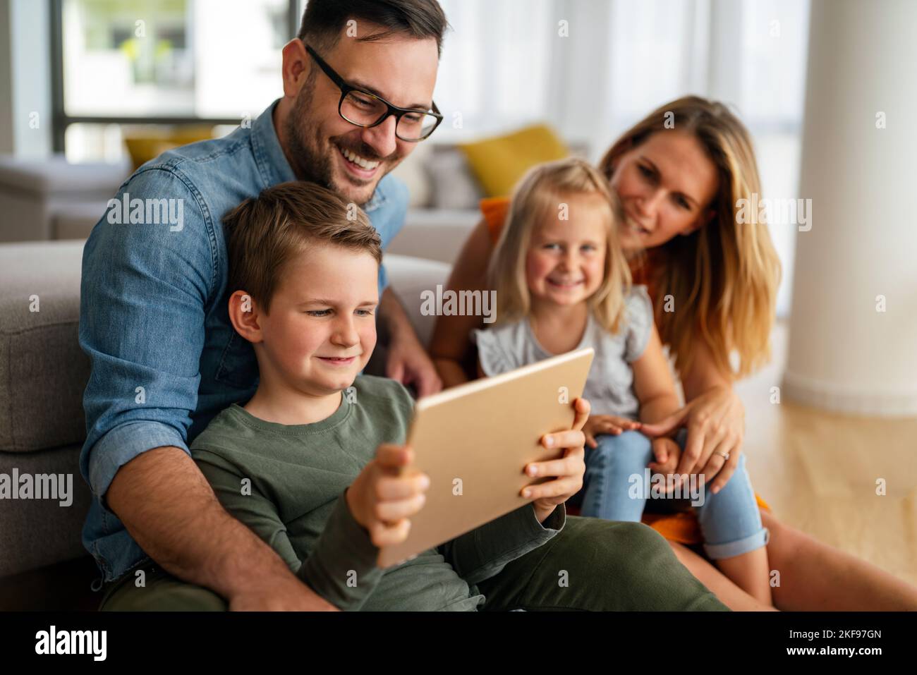 Device technology family online education concept. Happy family with ...