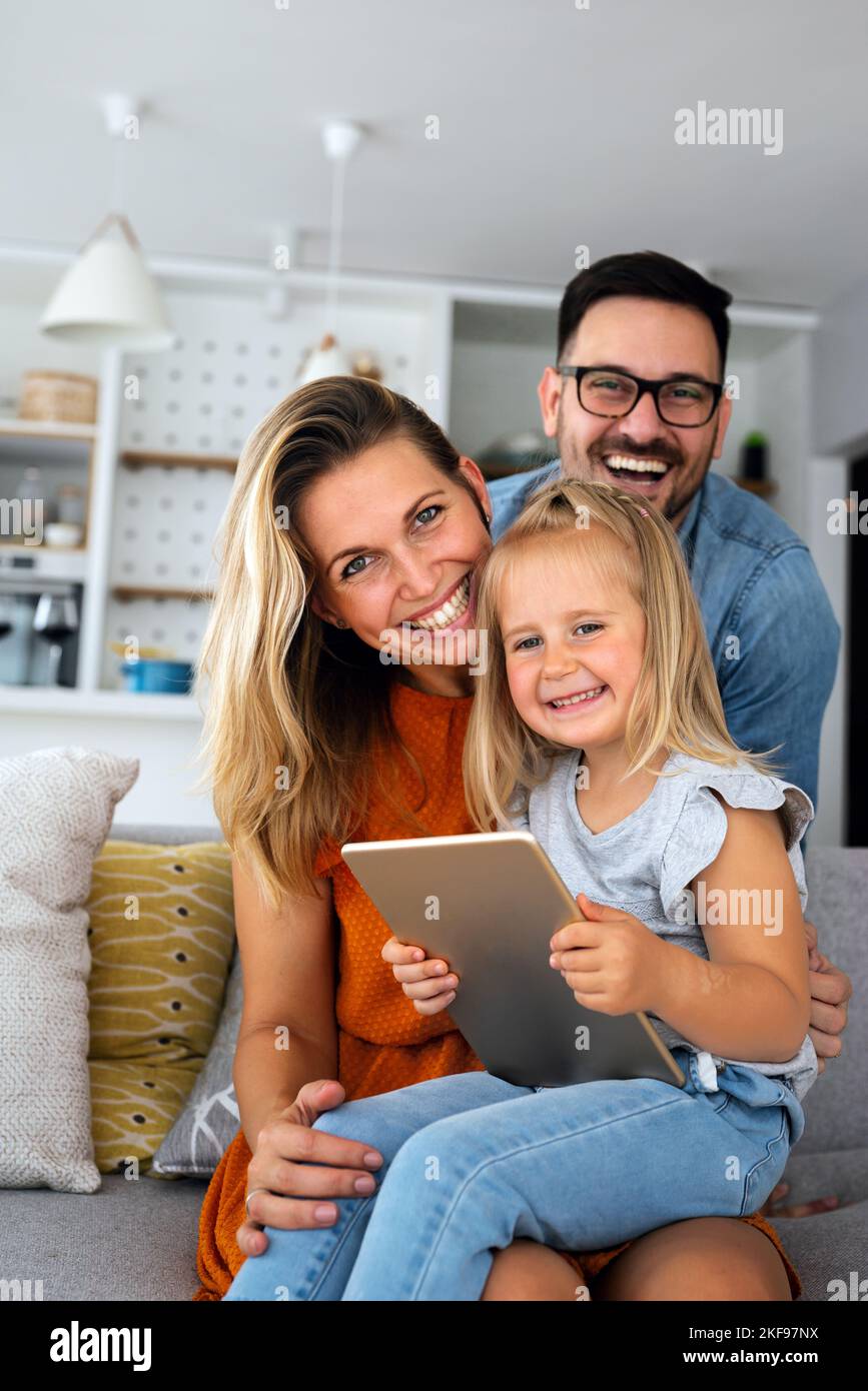 Device technology family online education concept. Happy family with ...