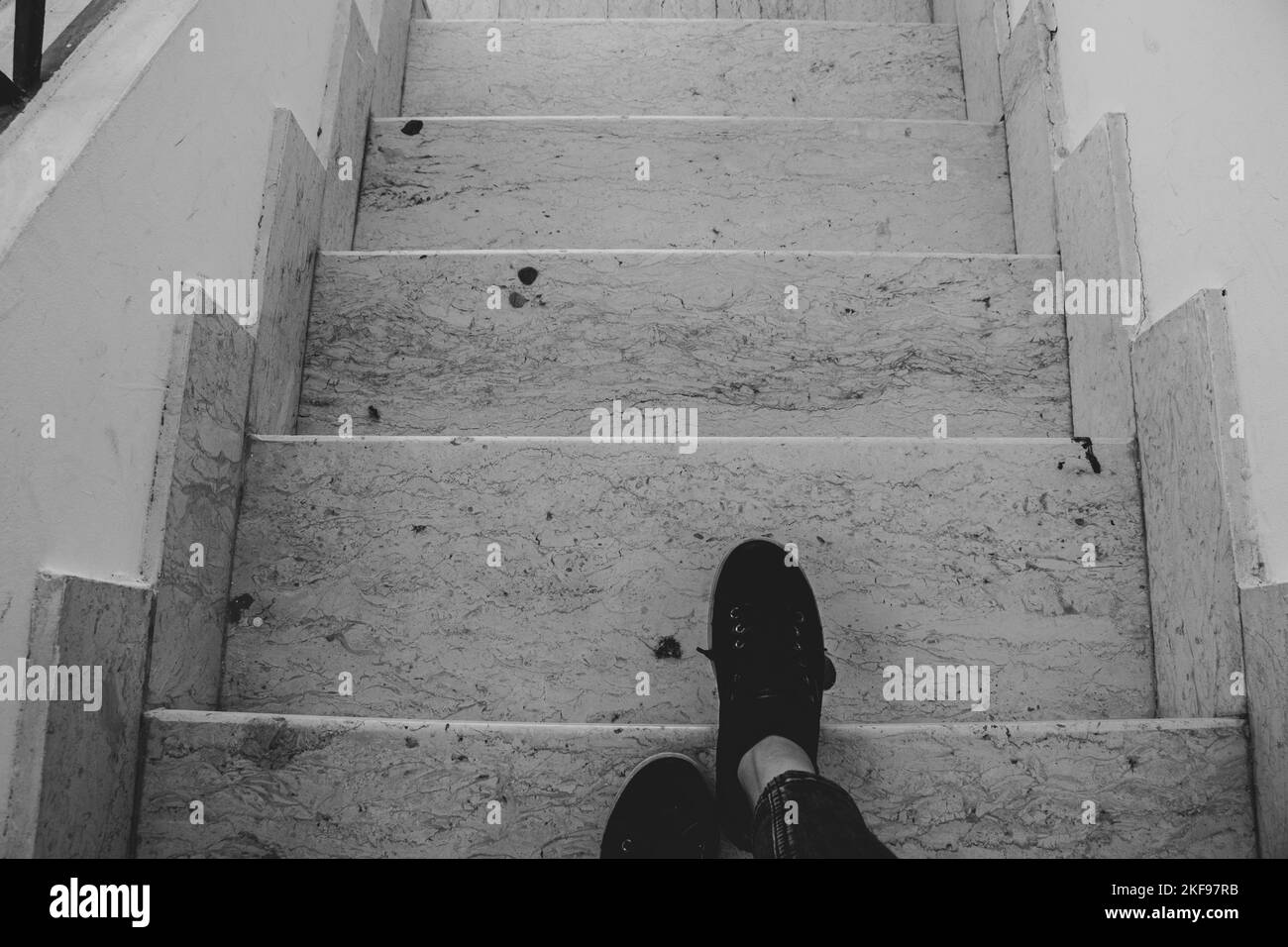 girl's feet on stone steps going down in a hotel building in Egypt ...
