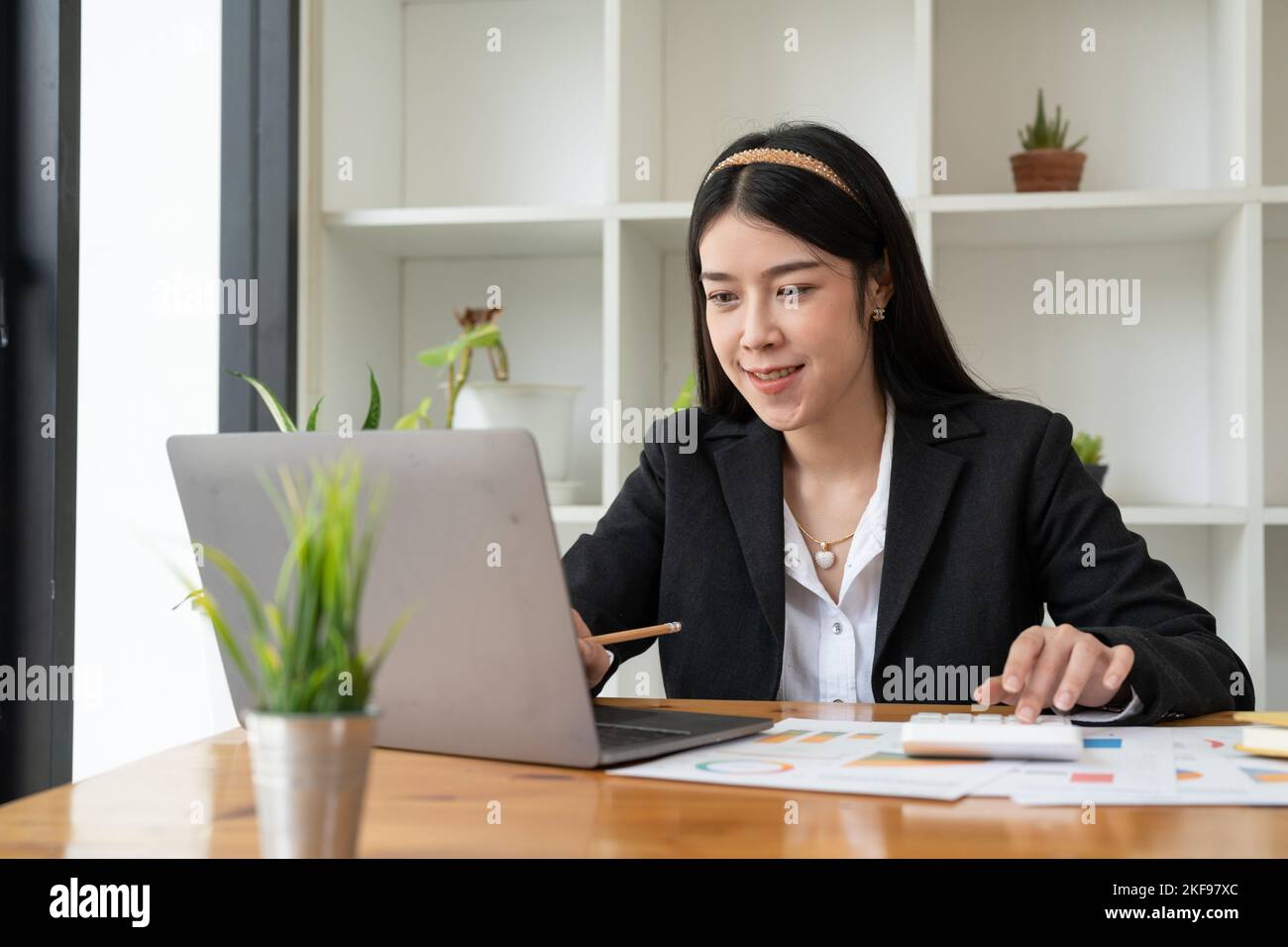Businesswoman using calculator for analysis maketing plan, Accountant ... Businesswoman using calculator for analysis maketing plan, Accountant ...
