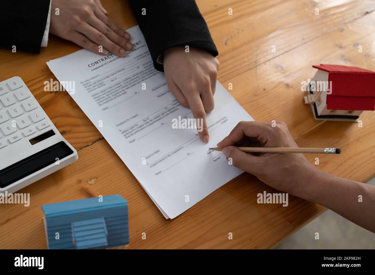 Real estate agent offer hand for customer sign agreement contract ...