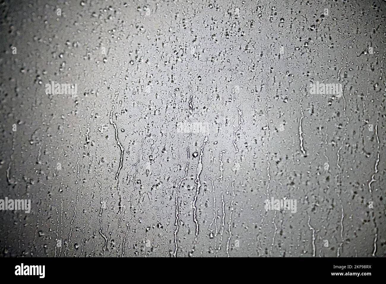 Peterborough, UK. 16th Nov, 2022. Raindrops on obscure glass, as heavy ...