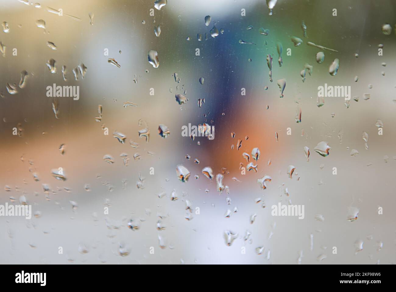 Portrait of man dressed as Santa Claus, posing to camera, on red ...