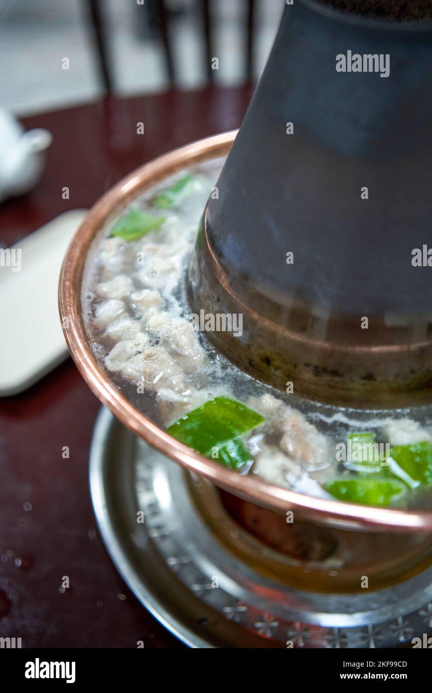 Traditional and delicious old Beijing copper pot mutton Stock Photo - Alamy