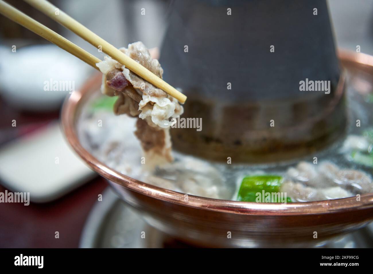 Traditional and delicious old Beijing copper pot mutton Stock Photo - Alamy