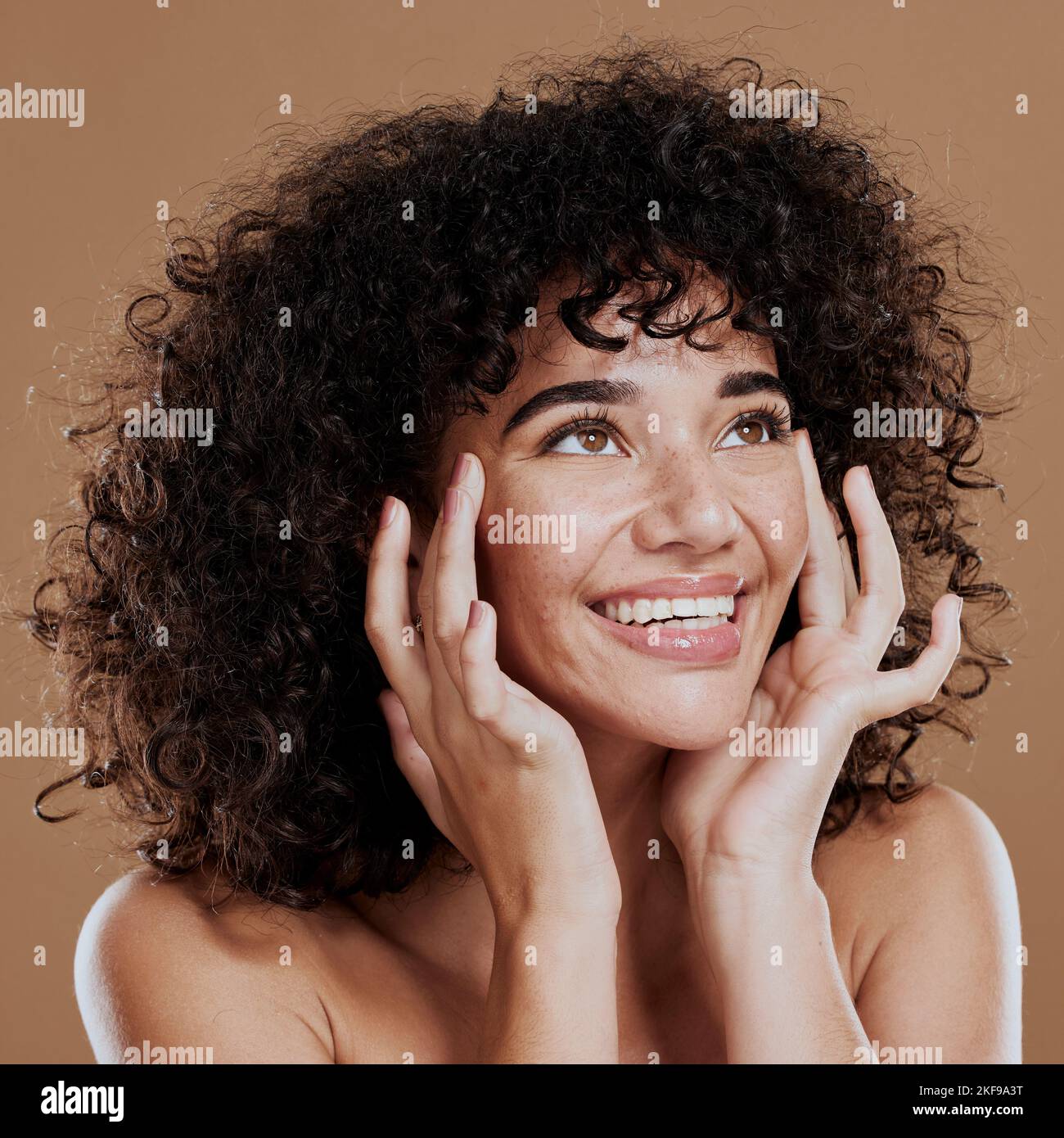 Beauty, woman and skincare, health and wellness for a Latin female on a brown studio background ...