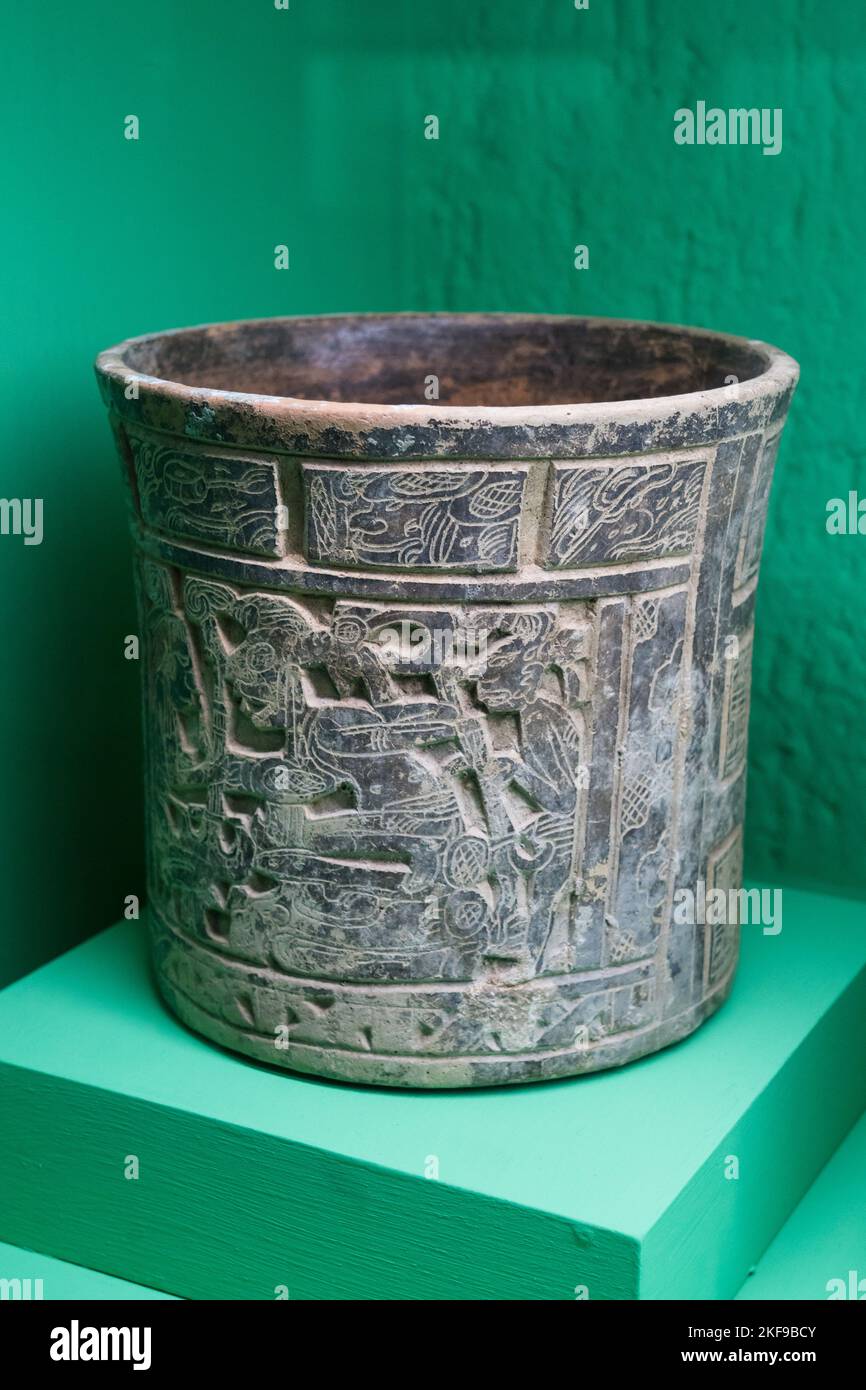 A ceramic vase with bas relief figures from the Classic Maya Period ...