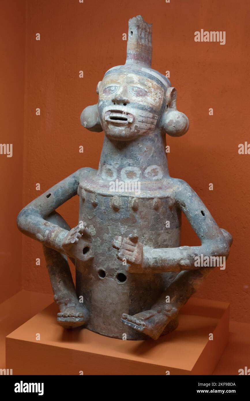 A ceramic figure of Xochipilli, the god of music, from Puebla. Rufino ...