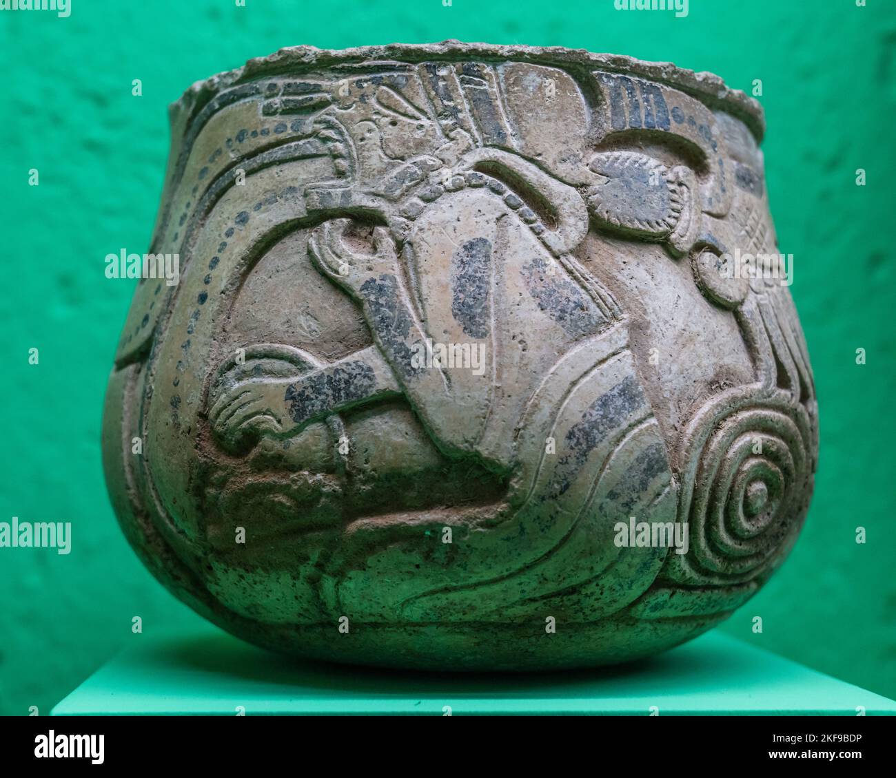 A ceramic vase with bas relief figures from the Classic Maya Period ...