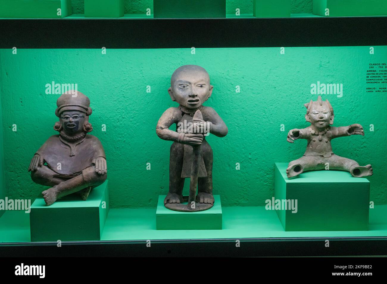 Ceramic figures of a seated woman, a warrior & a smiling child. Rufino ...