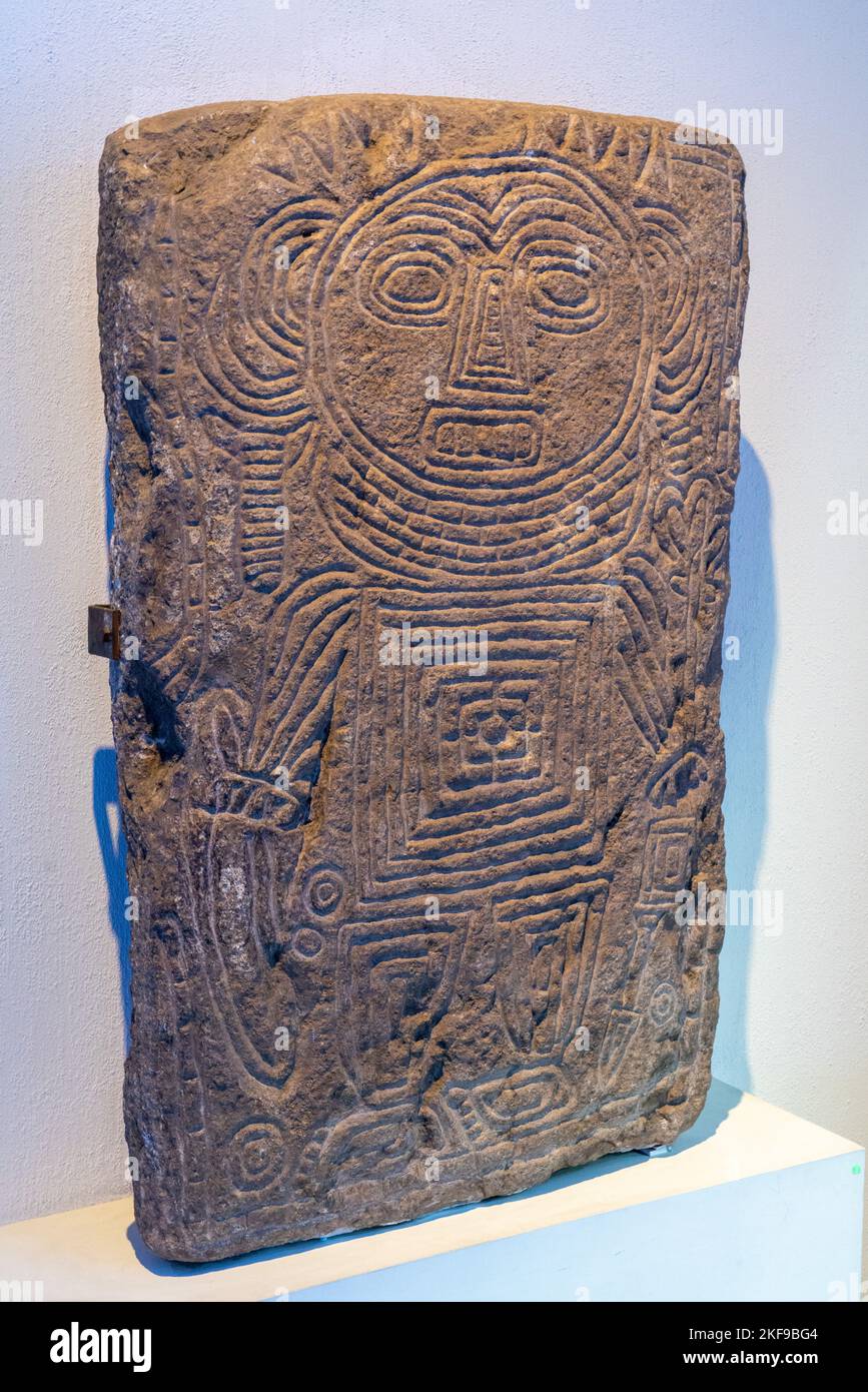 A carved stone stela from Guerrero with a stylized representation of a ...