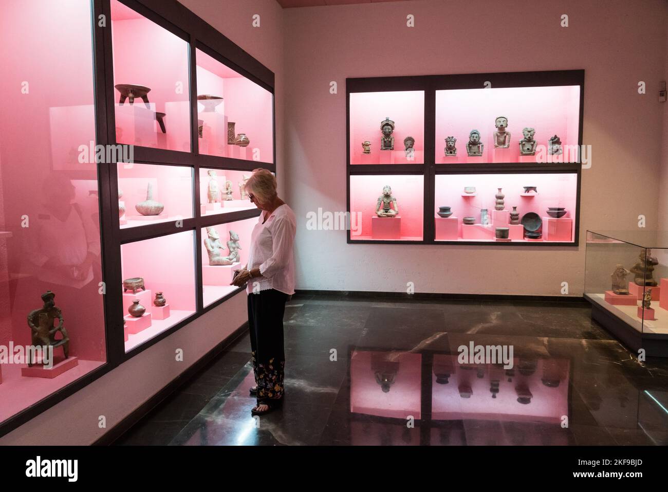 A woman tourist visits the Rufino Tamayo Museum of Pre-Hispanic Art of ...