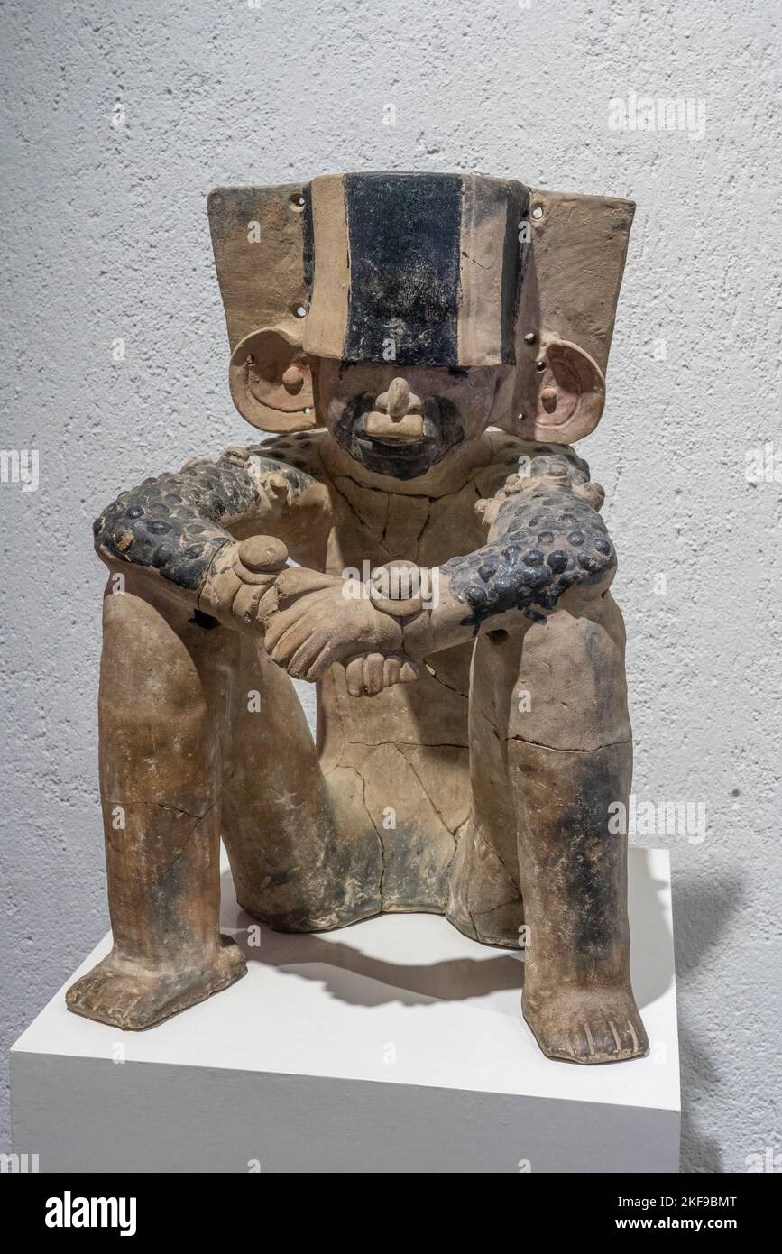 A large ceramic figure of a seated priest. Rufino Tamayo Museum of Pre ...