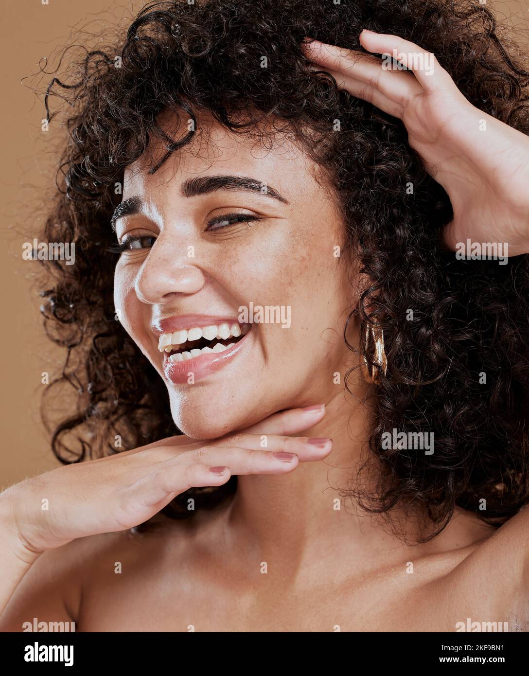 Portrait, woman and face makeup, happy and skincare with beauty, smile and happy in brown studio ...