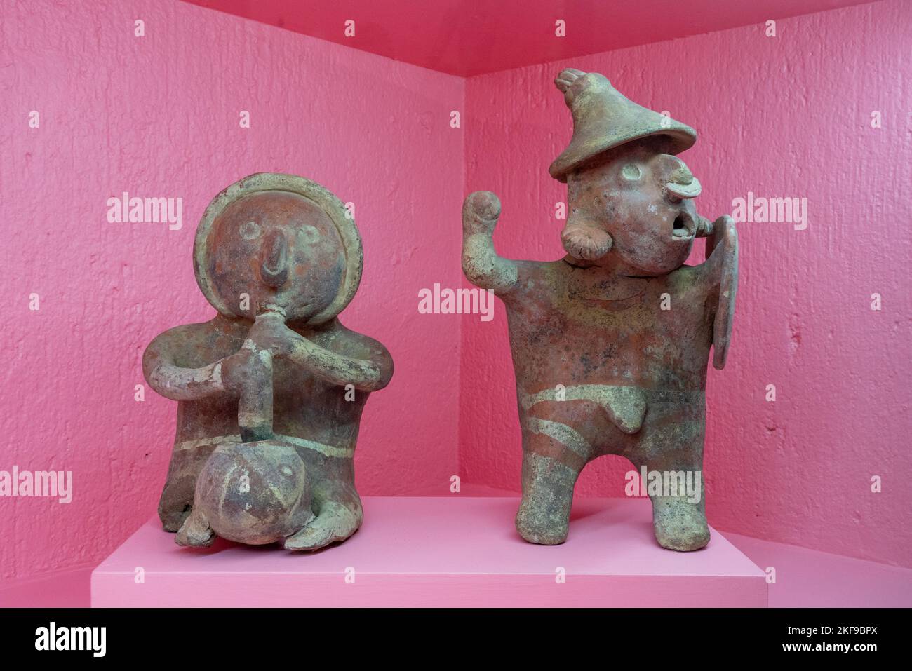 Ceramic figures of a warrior with a shield and a seated man, from ...