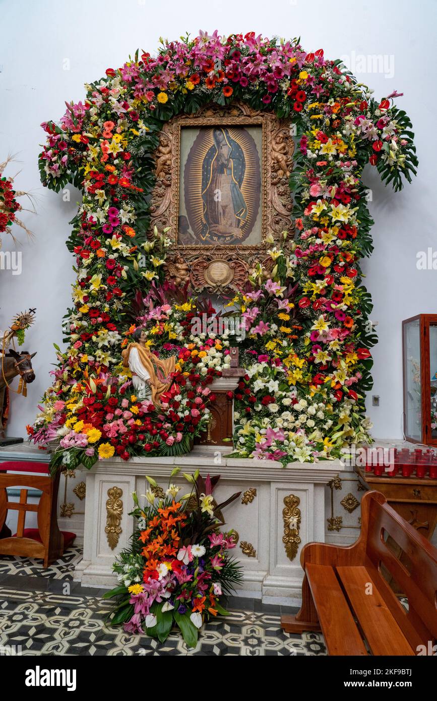 Flowers & painting oof the Virgin Mary in the Church of San Antonino ...