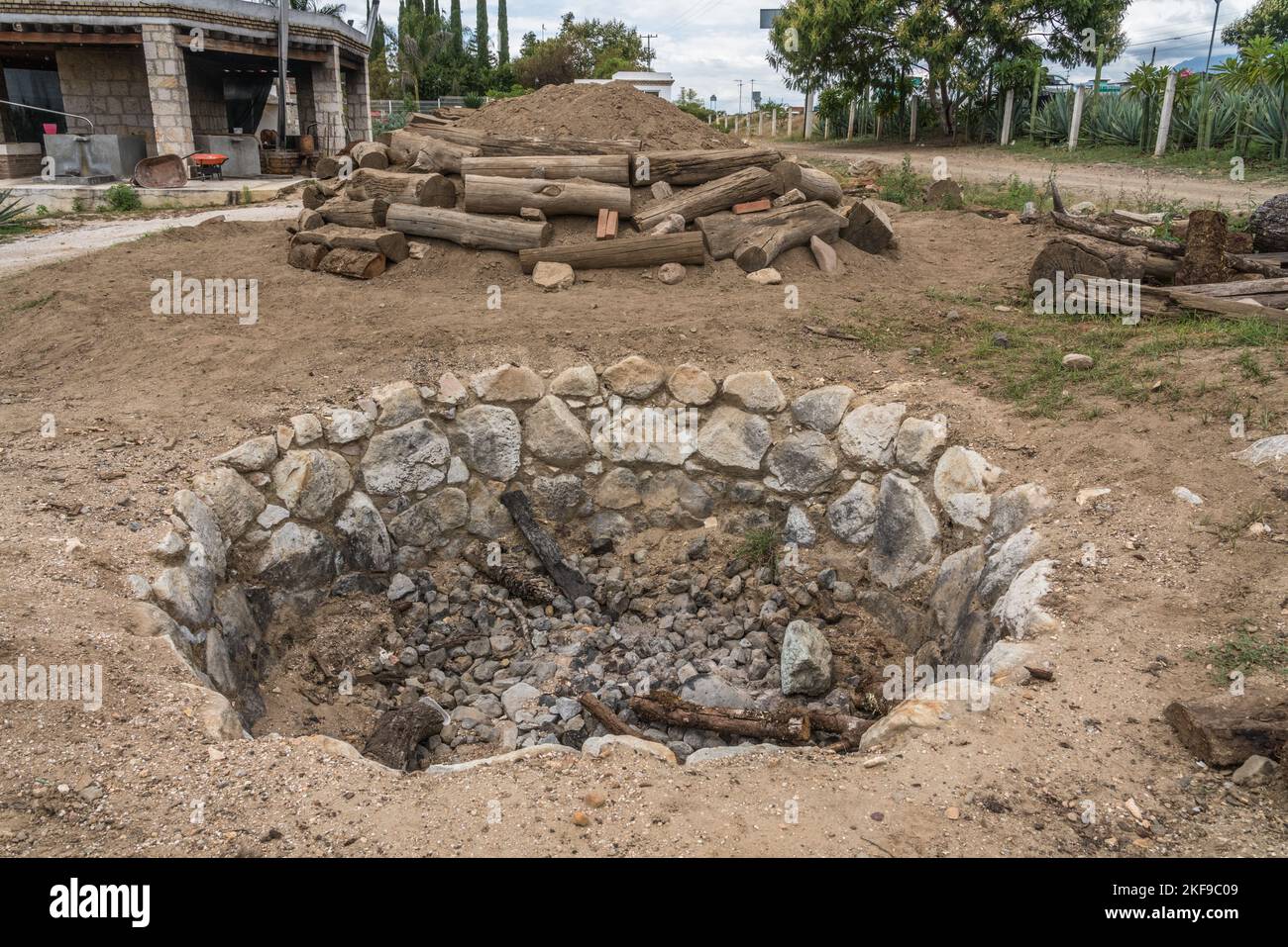 A fire pit or oven for roasting the agave hearts at an artisanal mezcal ...