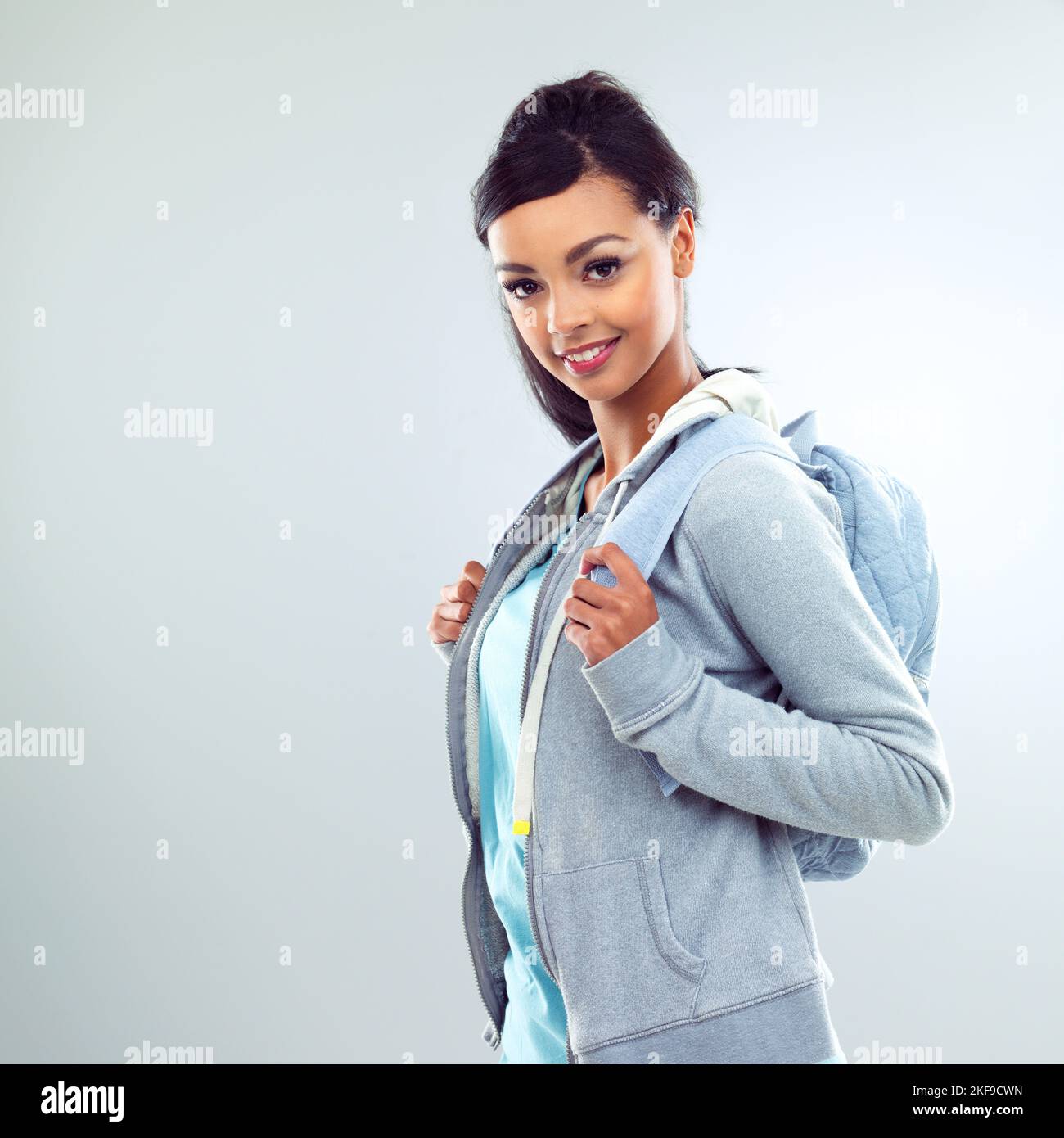 Be your own motivation. a pretty young student wearing a backpack over ...