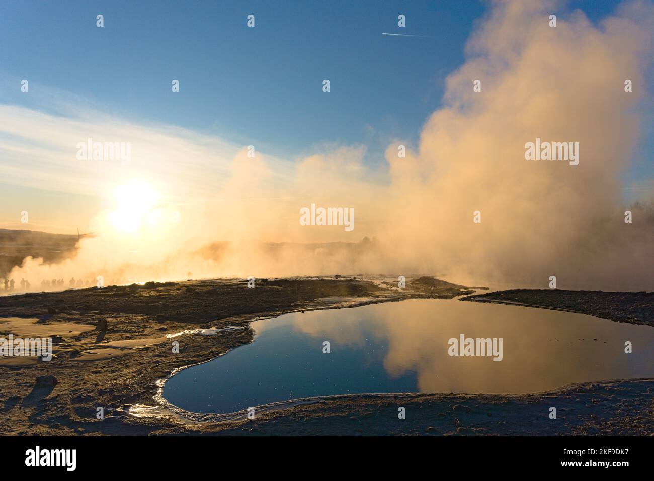 A landscape of Strokkur fountain snowy glacier in the water, Iceland at ...