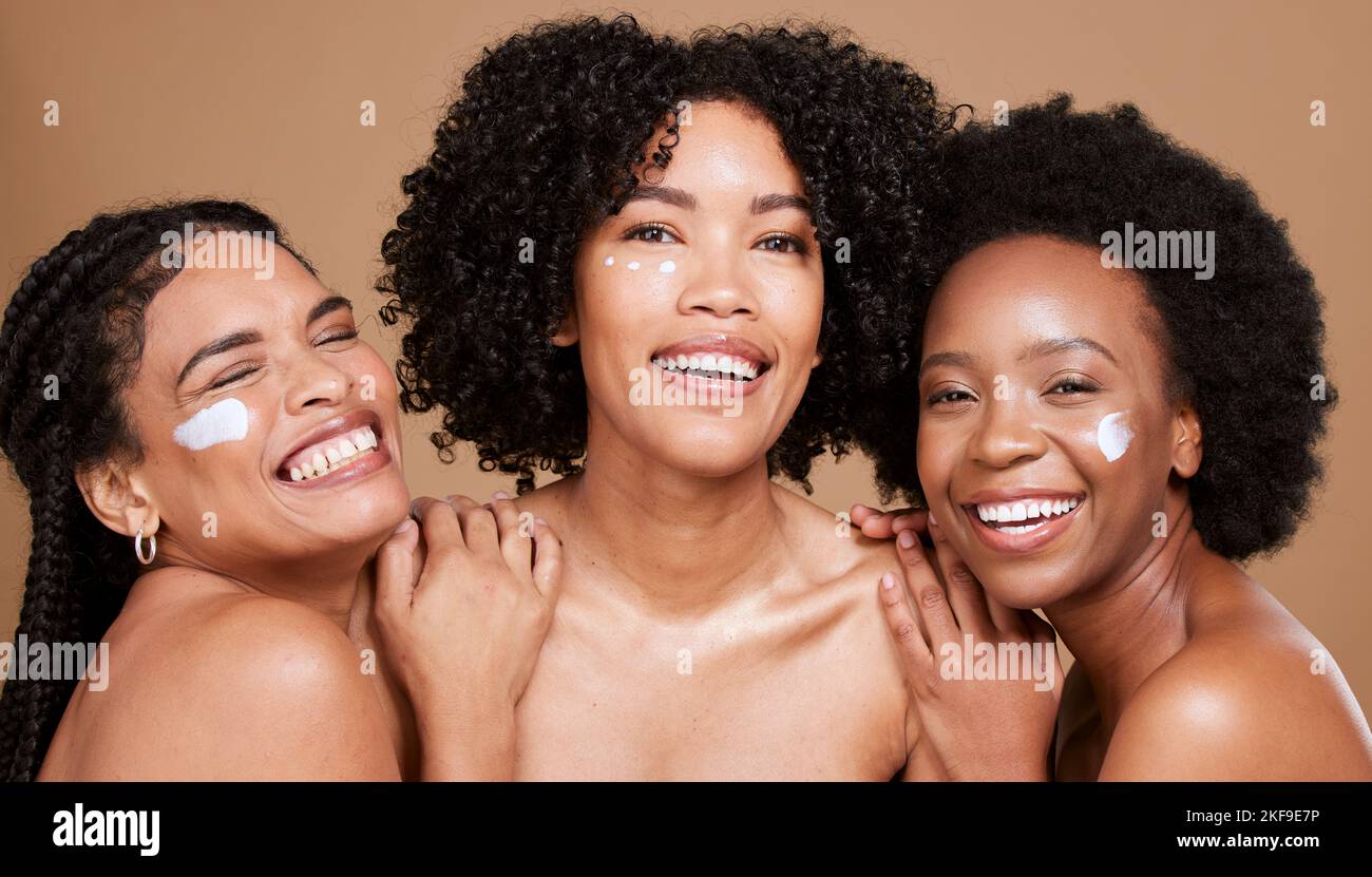 Beauty skincare, friends and black women with face cream in studio for ...