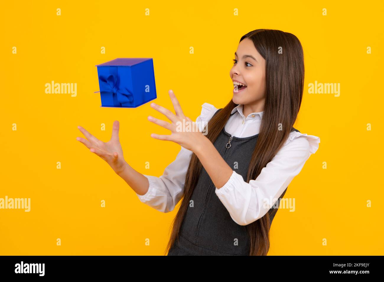 Teenager kid with present box. Teen child girl giving birthday gift ...