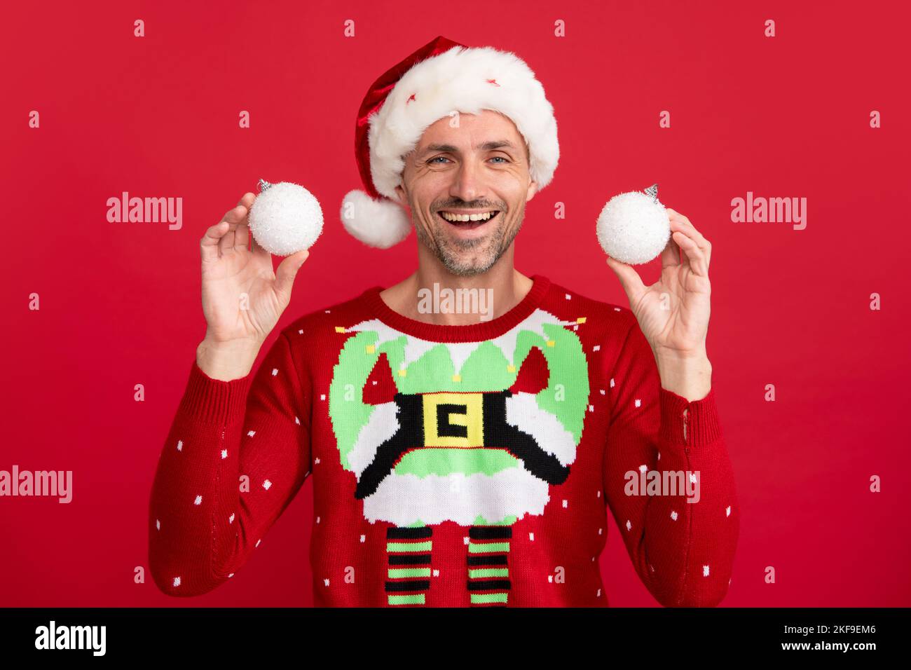Portrait of christmas santa man on red studio background. Santa with ...
