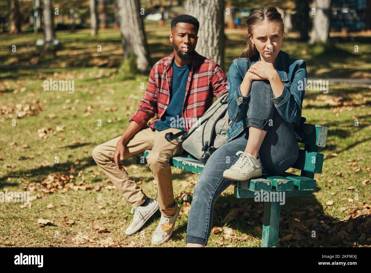 Angry, fight and interracial couple in conflict in a park with stress ...