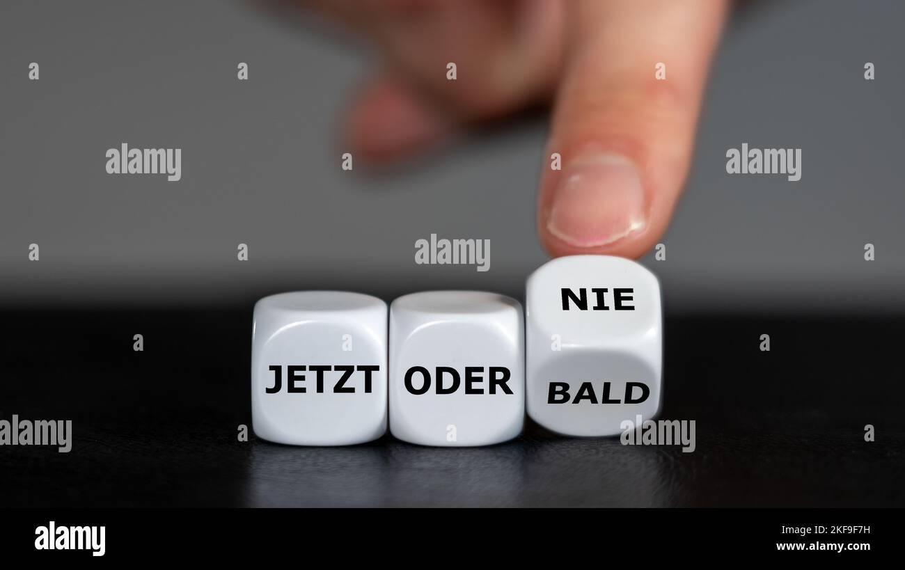 Hand turns dice and changes the German expression 'jetzt oder bald ...