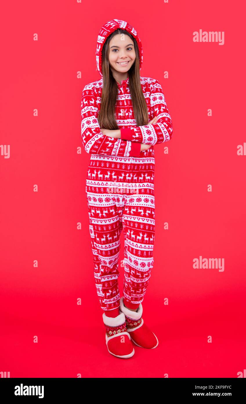 happy new year. glad teen girl in red new year clothes standing in ...