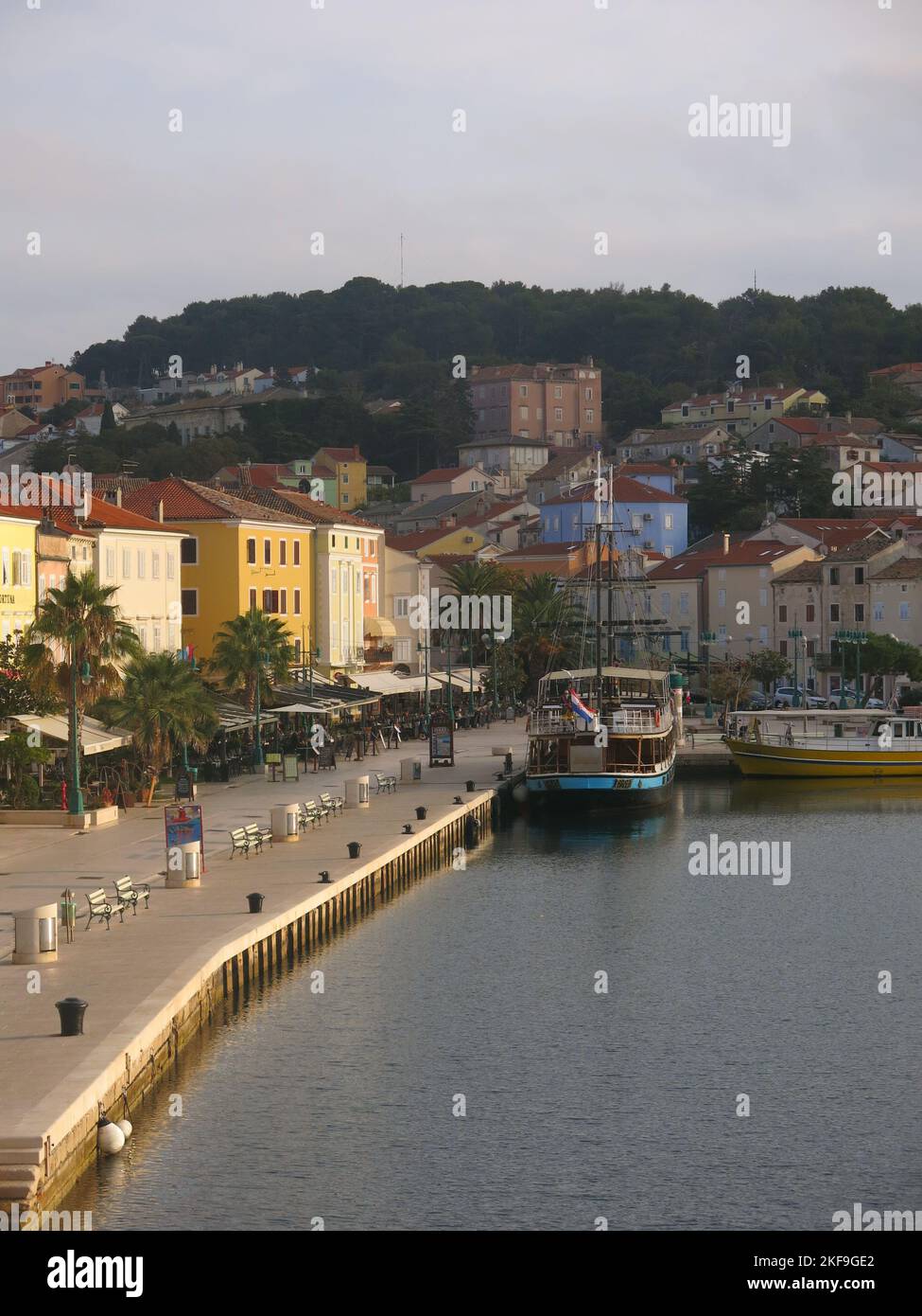 View of the colourful town houses and boats moored at the seafront of ...