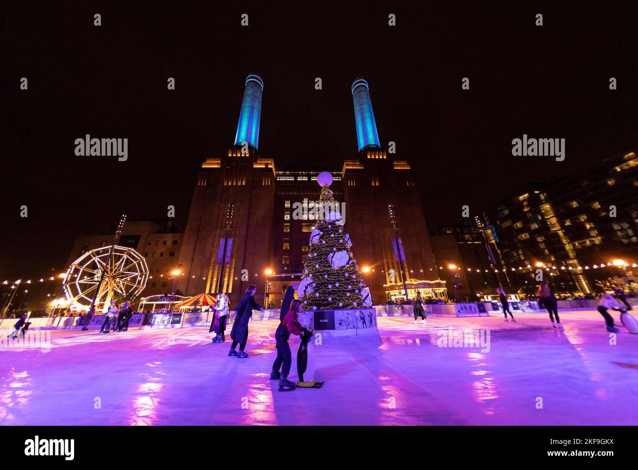 People enjoy the opening of the Battersea Power Station Ice Rink ...