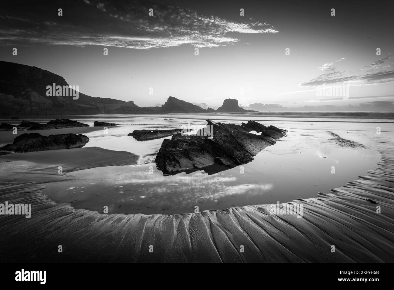 Sunset with rocks and sand Black and White Stock Photos & Images - Alamy